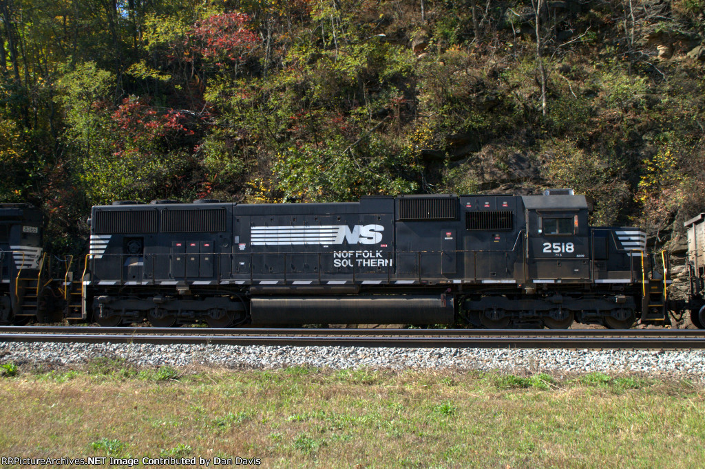 NS SD70 2518 trails on 591